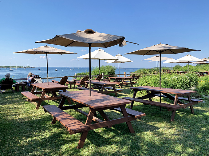 The outdoor dining area offers panoramic ocean views where sailboats drift by as you savor Maine's freshest seafood.