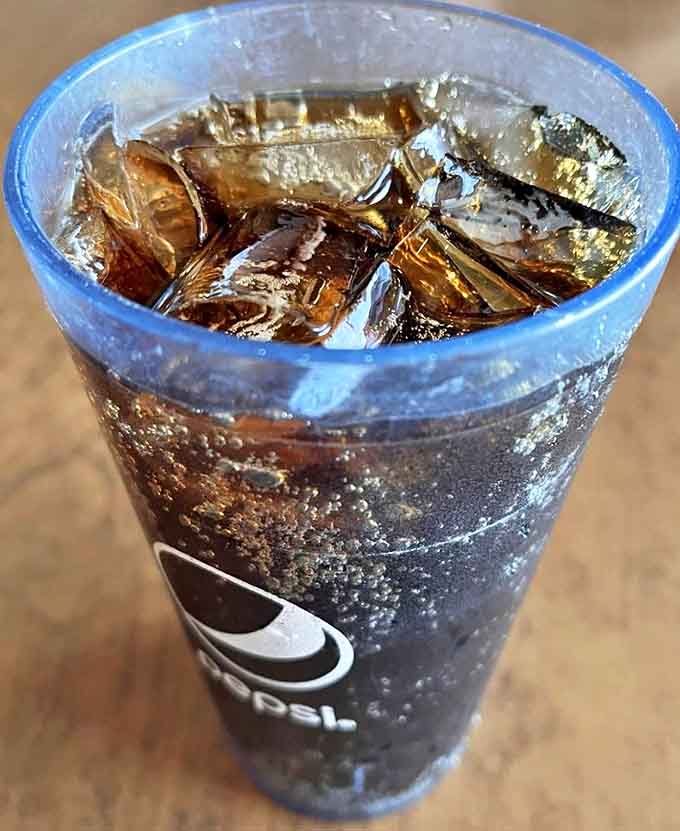 Ice-cold Pepsi in a proper glass&mdash;simple refreshment done right, no fancy presentation needed.