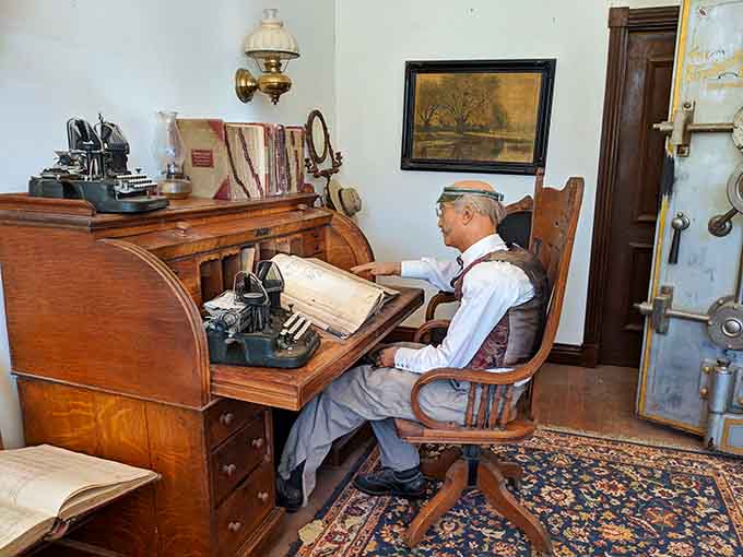 This bookkeeper's workspace, complete with period desk and equipment, shows how frontier businesses maintained records in the pre-computer era.