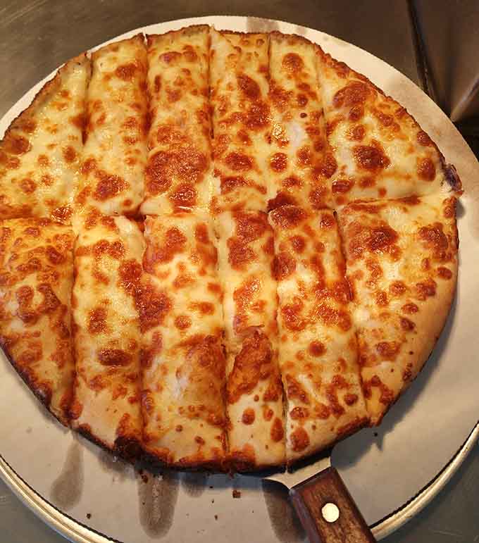 Sometimes the simplest pizza is the best pizza, as this gloriously cheesy creation demonstrates with bubbling, golden perfection.