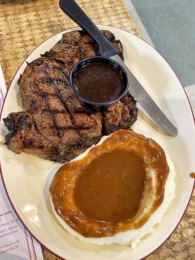 A perfectly grilled steak with a crater of gravy-filled mashed potatoes &ndash; carnivore heaven that's worth every penny.