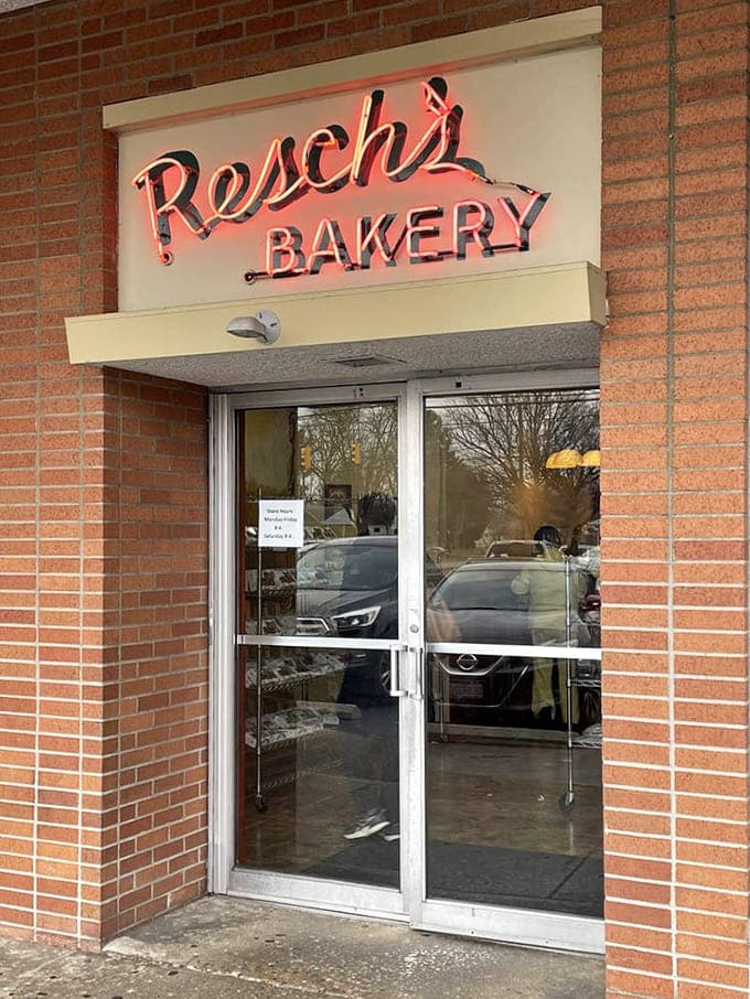 The exterior at dusk, when the bakery glows like a lighthouse guiding hungry souls to their carbohydrate destiny.