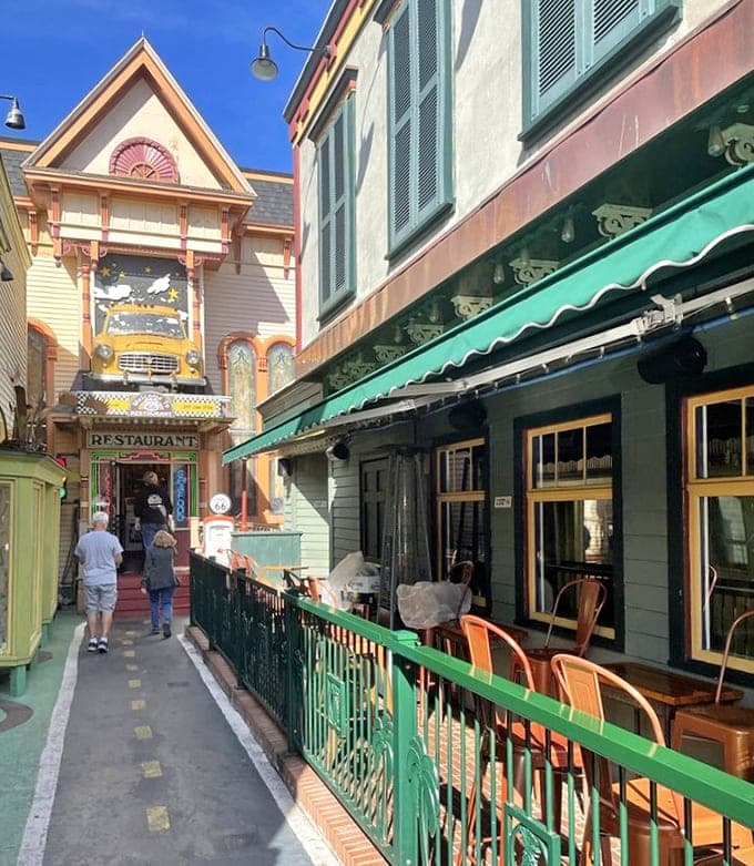 The walkway between buildings maintains that retro charm, making even the journey to your table part of the experience.