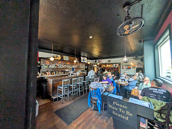 Regulars and first-timers share space at the bar, united by their appreciation for good food, cold drinks, and zero pretension.