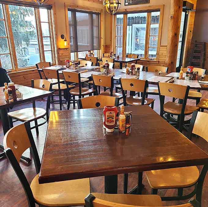 Another angle of the dining room showing off those gorgeous windows and the kind of tables where good conversations happen naturally.