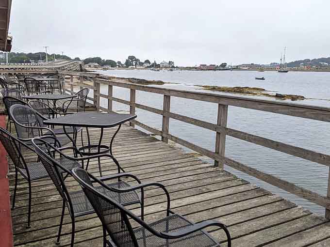 Waterfront deck seating offers front-row seats to harbor life, where your biggest decision is whether to order seconds or thirds.