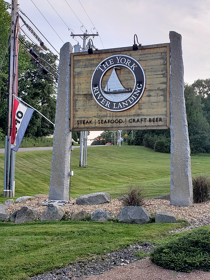 The rustic sign announces your arrival at seafood paradise, where steak, seafood, and craft beer await the hungry traveler.