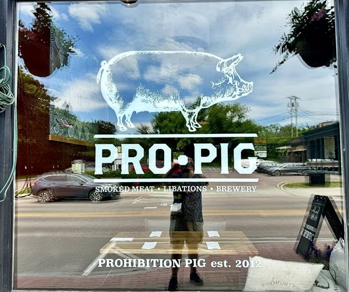 The iconic Pro Pig logo etched in glass promises what awaits inside: "Smoked Meat &bull; Libations &bull; Brewery" &ndash; a trinity of pleasures for the discerning visitor.