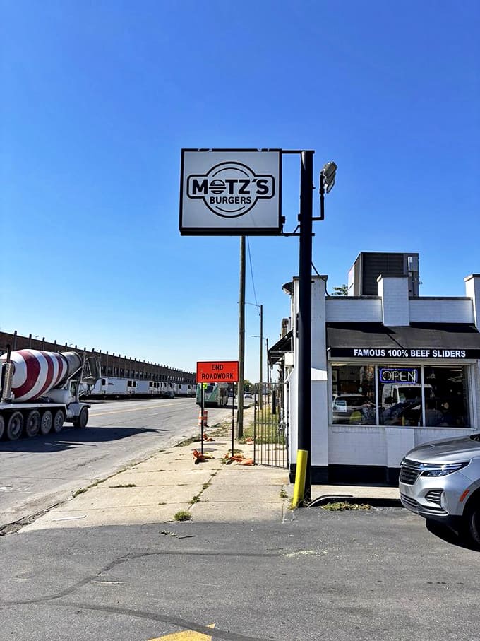 Motz's sign stands tall against the Detroit sky, a landmark for burger pilgrims seeking slider salvation in the Motor City.