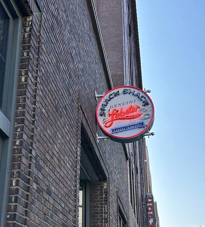 The vintage-inspired neon sign announces that genuine lobster awaits inside, a beacon for seafood lovers throughout the Twin Cities.