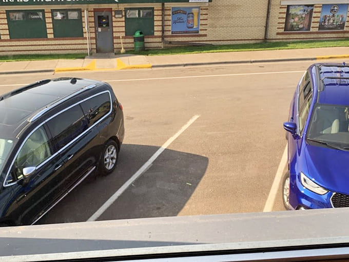 The parking lot view shows small-town Minnesota life, where finding a spot near your favorite breakfast caf&eacute; counts as a morning victory.