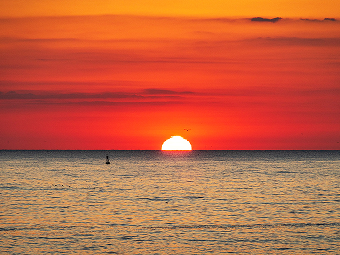 The day's first light transforms the Atlantic into liquid gold, a moment of such perfect tranquility it makes even non-morning people glad they set their alarms.