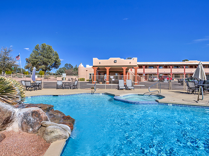 Autumn leaves dust wooden steps with golden confetti, nature's seasonal celebration adding ephemeral beauty to the enduring trail.