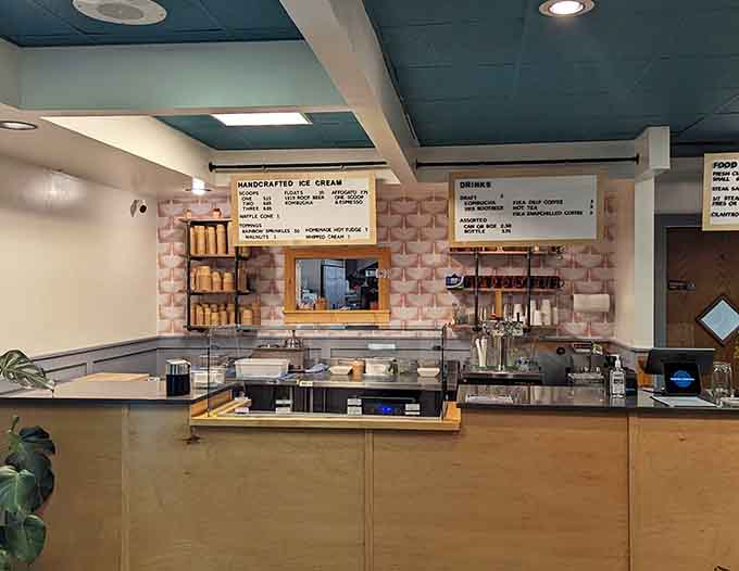 The counter area where dreams come true, one scoop at a time, with friendly staff ready to help you make the tough decisions.