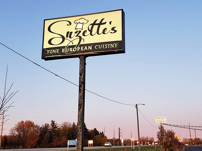 The roadside sign beckons travelers to discover fine European dining in the most unexpected of locations along the highway.