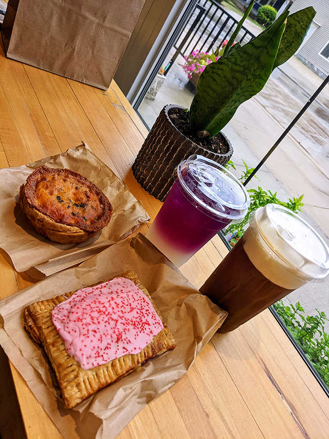 Morning perfection: a savory pastry, sweet pop-tart, and duo of drinks create a spread that makes you wonder why all breakfasts can't be this delightful.