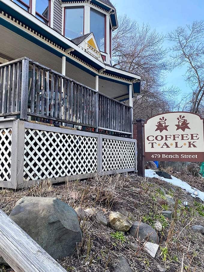 Coffee Talk beckons from its Victorian perch, promising caffeine and conversation in a setting that feels like visiting a friend's porch.
