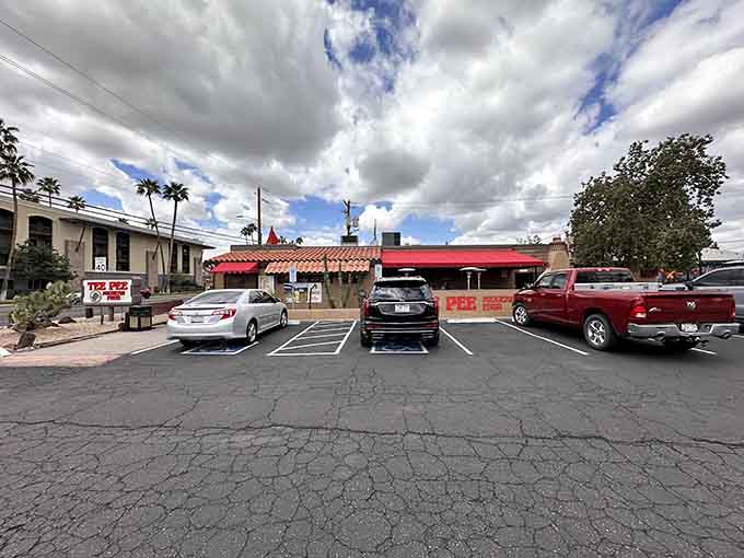 The parking lot might look ordinary, but it's the gateway to extraordinary cheese-covered happiness that awaits just steps away inside.