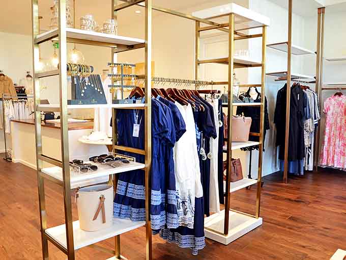 The Barefoot Princess: Curated collections of resort wear hang like colorful promises, each piece whispering tales of elegant beachside dinners and sunset strolls.