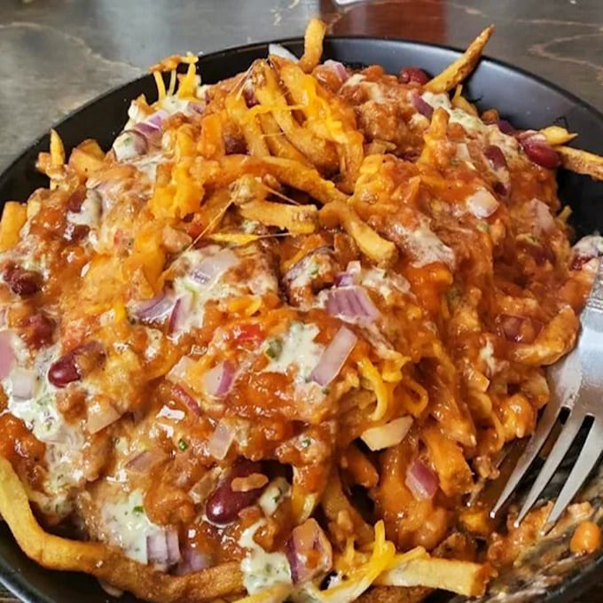 Fries elevated to main course status &ndash; this mountain of cheesy, saucy goodness requires both a fork and a moment of silent appreciation.