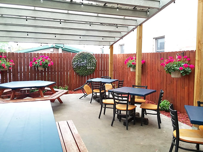 The outdoor patio offers fresh air dining with string lights overhead, perfect for Minnesota's precious warm weather months.