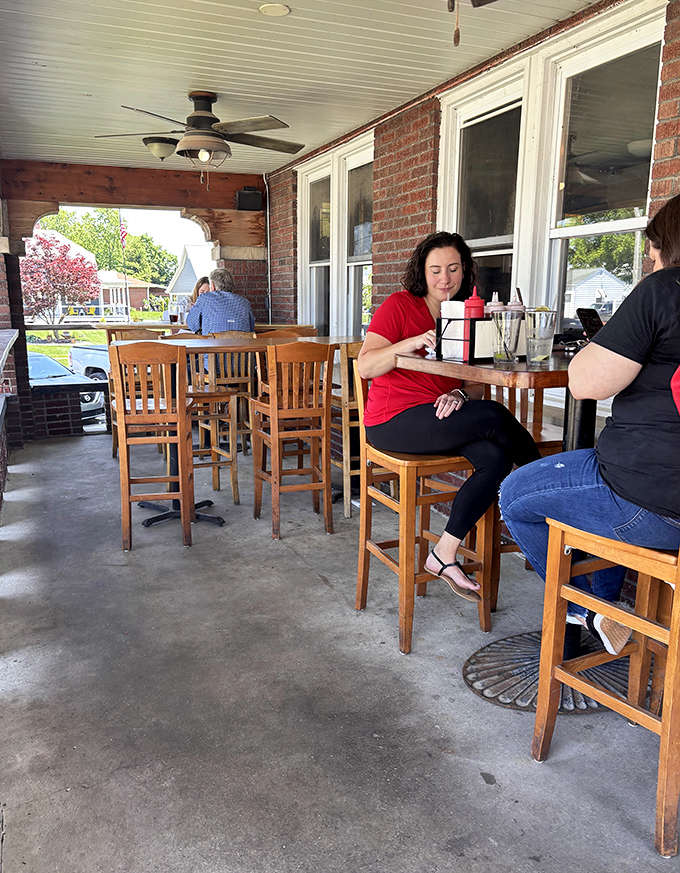 The front porch offers prime people-watching real estate while you work your way through a plate of wings that refuse to be ignored.