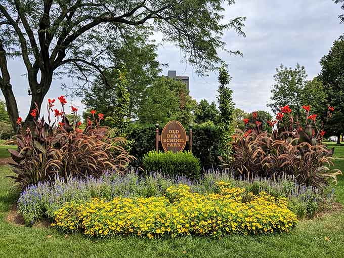 The Old Deaf School Park sign marks the entrance to what might be Ohio's most unexpected artistic treasure hiding in plain sight.
