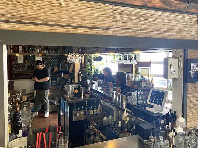 The open kitchen lets you watch the magic happen, with skilled hands crafting each bowl while you sip your drink and anticipate what's coming.