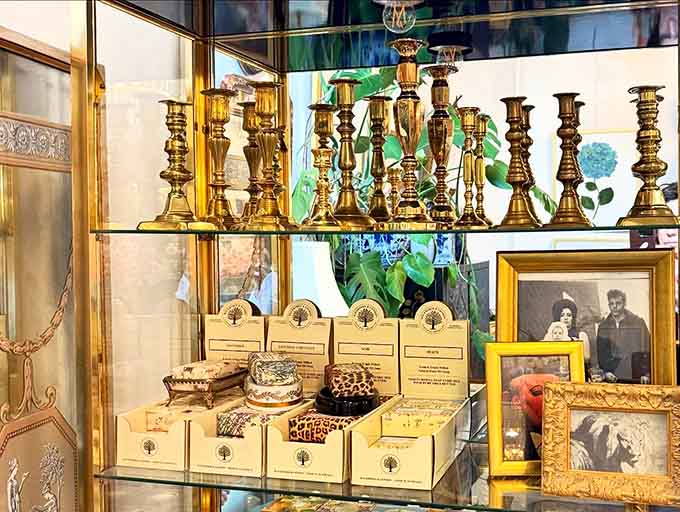 Brass candlesticks in varying heights create drama without saying a word, like the strong silent type of home decor that never goes out of fashion.