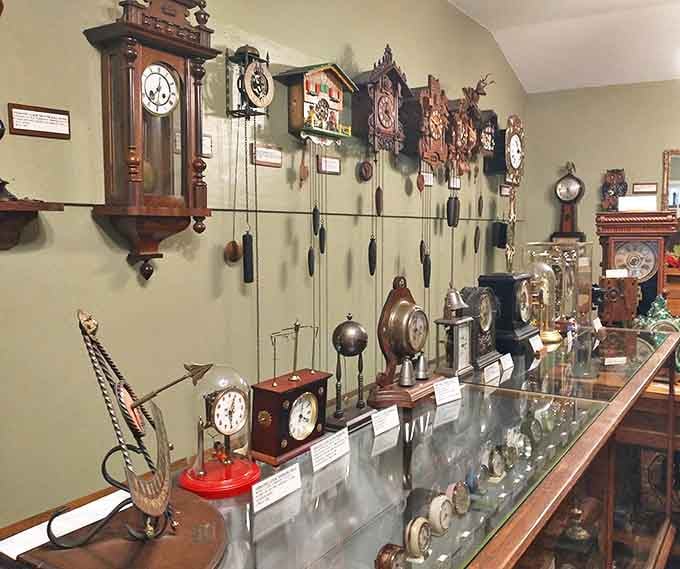 Ornate grandfather clocks stand alongside delicate timepieces, their pendulums swinging in hypnotic rhythm, marking moments from another century.