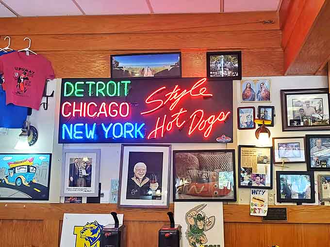 Wall of Fame: Neon proclaims hot dog allegiances while framed memories tell the story of a restaurant deeply woven into the community fabric.