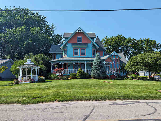 Water's Edge Retreat's colorful Victorian architecture stands as a cheerful beacon, promising comfortable beds after days of island adventure.