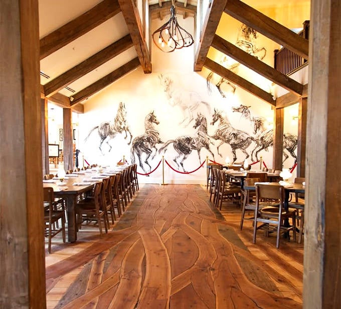 This dining area showcases the stunning wooden floor with its flowing, river-like pattern &ndash; functional art beneath your feet.