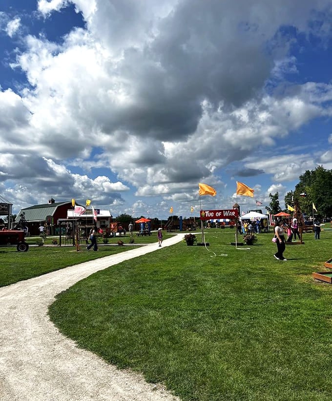 The festival grounds stretch out under dramatic clouds, offering activities and attractions that keep families entertained for hours on end.
