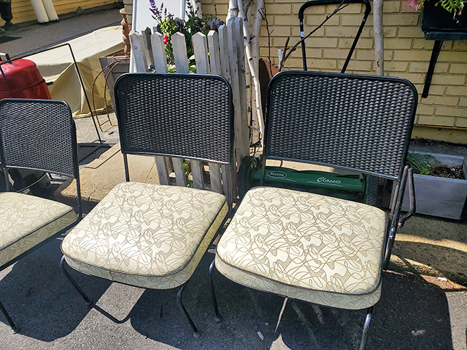 Mid-century patio chairs with their original cushions invite you to imagine summer evenings past, when neighbors gathered for cocktails under the stars.