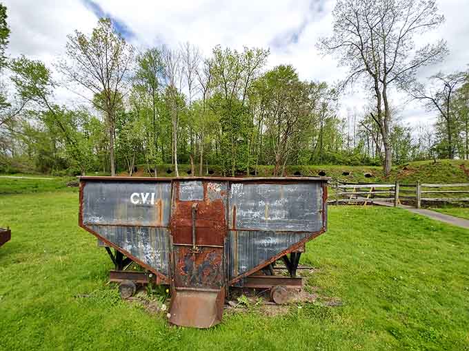 This rusty coke hopper wagon sits as a silent witness to the days when this park was a bustling industrial site rather than a peaceful retreat.