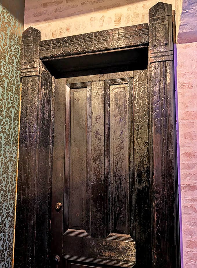 Weathered wooden doors throughout the castle stand as portals between worlds, their intricate carvings hinting at countless stories beyond.