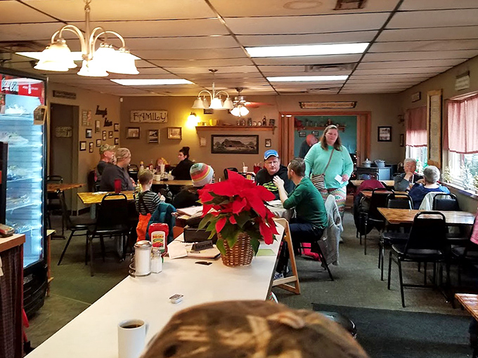 A cozy dining room filled with locals enjoying good company and classic small-town caf&eacute; comfort.