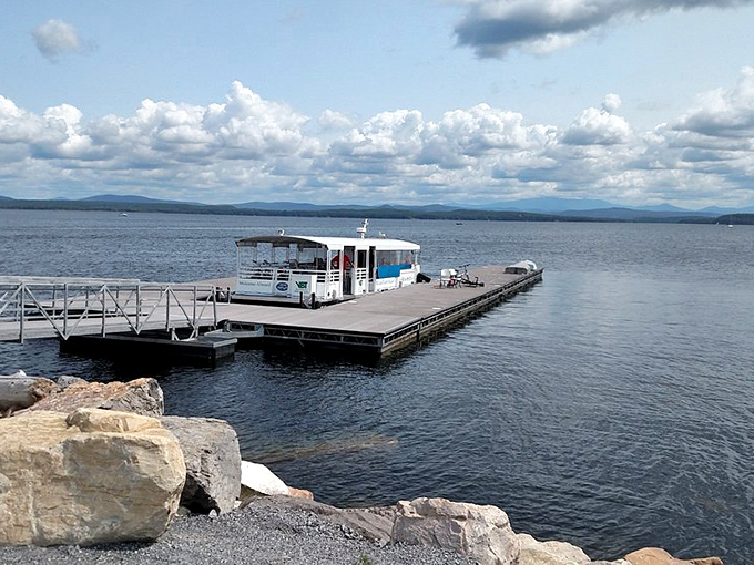 The dock extending into Lake Champlain serves as both practical ferry landing and perfect sunset-watching platform for evening visitors.