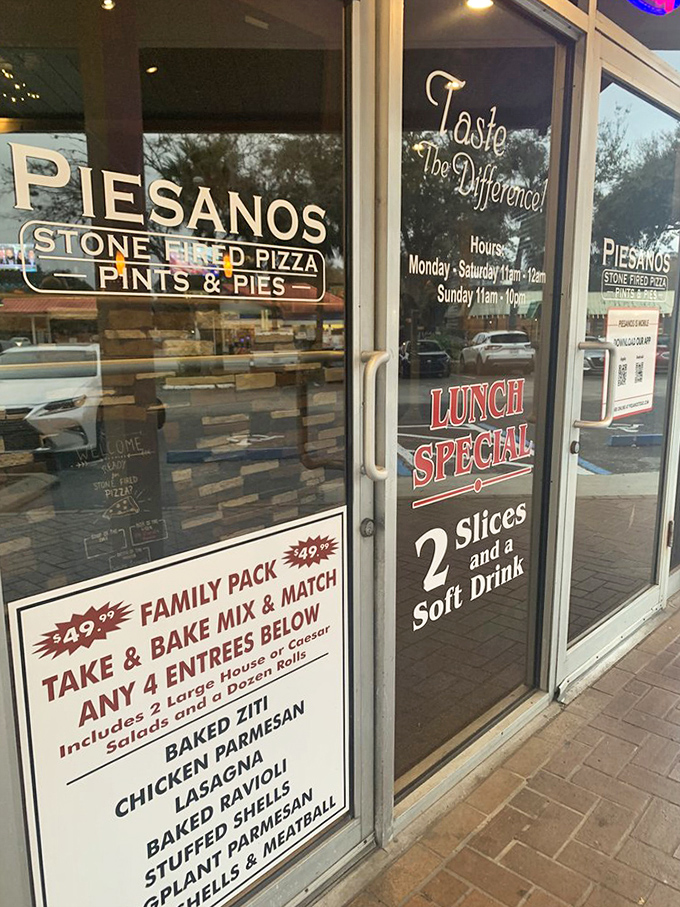 The entrance promises lunch specials that make midday indulgence both accessible and irresistible&mdash;two slices and a drink is practically responsible adulting.