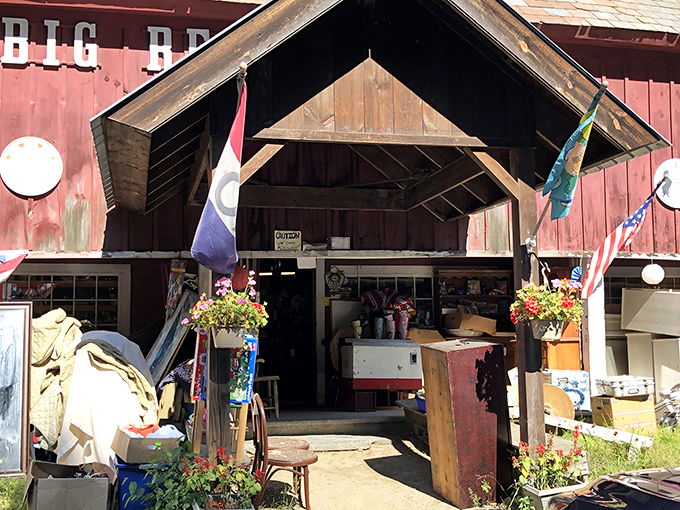The entrance beckons with flags fluttering in Vermont breezes, promising adventures in time travel just beyond those weathered wooden doors.