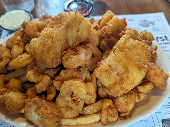 The fried seafood platter &ndash; a golden mountain of crispy goodness that makes calorie-counting seem like a concept from another dimension.