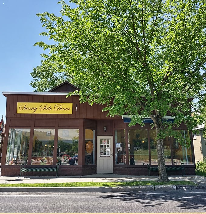 Sunny Side's welcoming facade framed by Vermont greenery. This little diner has been breaking breakfast hearts for years.