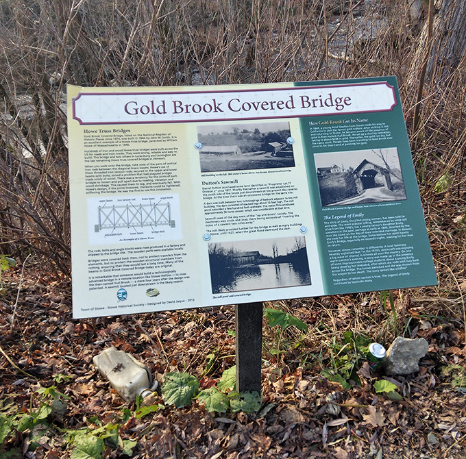 The informational sign tells the bridge's official history, though locals are more likely to share tales of ghostly encounters.