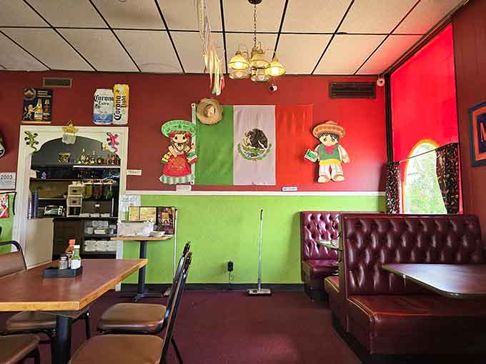 Step inside this friendly Mexican restaurant featuring colorful walls, festive decorations, a proud flag, and cozy booths for your meal.