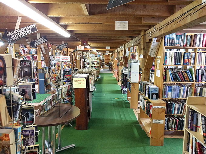 The book section stretches seemingly to infinity, with carefully organized shelves creating a library atmosphere that invites hours of browsing.