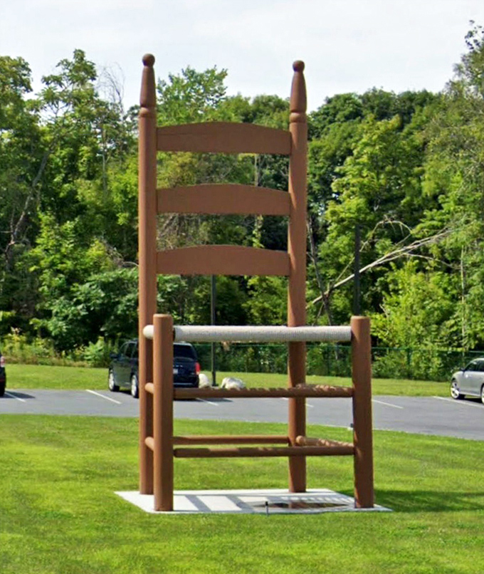 Standing proudly on its well-maintained patch of grass, the chair serves as both art installation and community landmark.