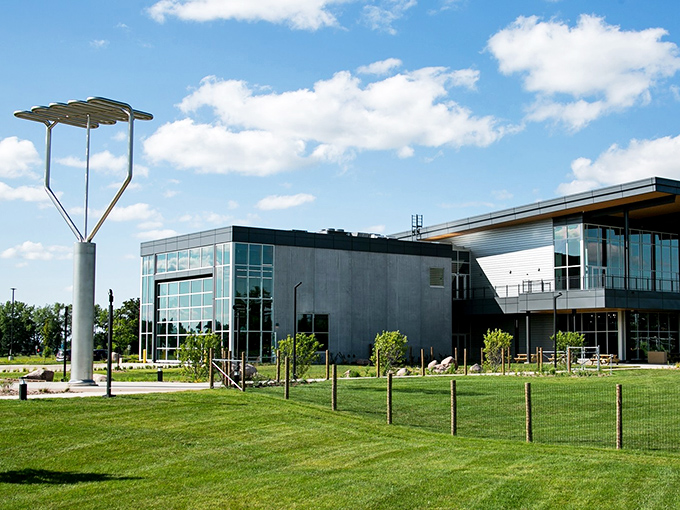 The 1000 Islands Environmental Center emerges from the landscape like a sustainable vision of agriculture's future, crowned by its playful mascot.