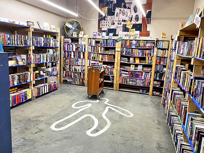 Is that a chalk outline on the floor? A playful nod to mystery novels that brings smiles to browsing detectives.