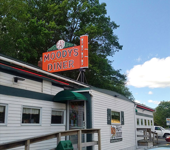 Moody's exterior might be humble, but that sign promises culinary treasures that keep travelers coming back decade after decade.